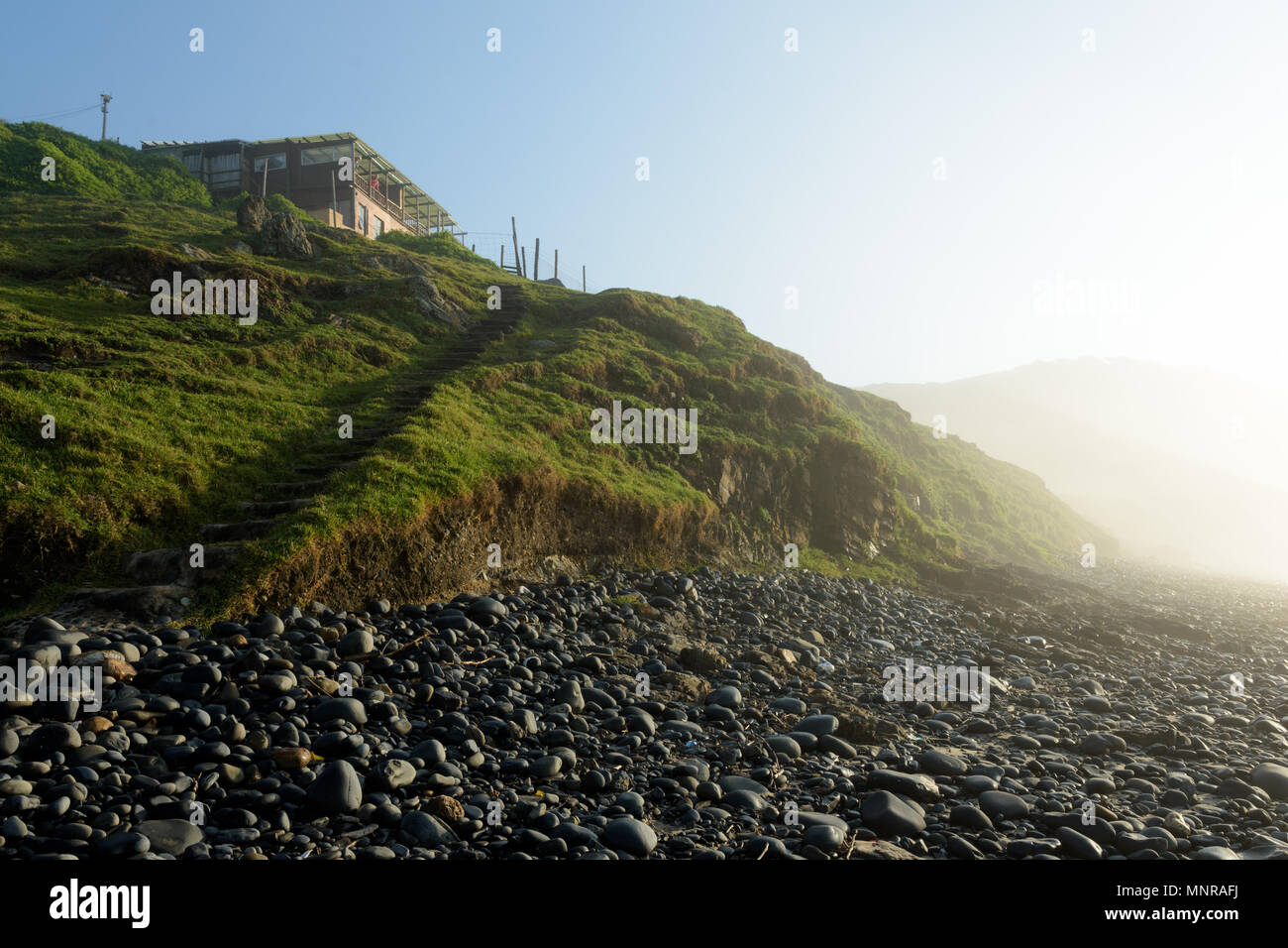 Cabin overlooking beach at sunrise Stock Photo - Alamy