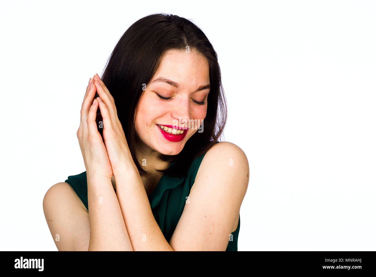 Emotional young girl on a white background, studio lighting Stock Photo ...