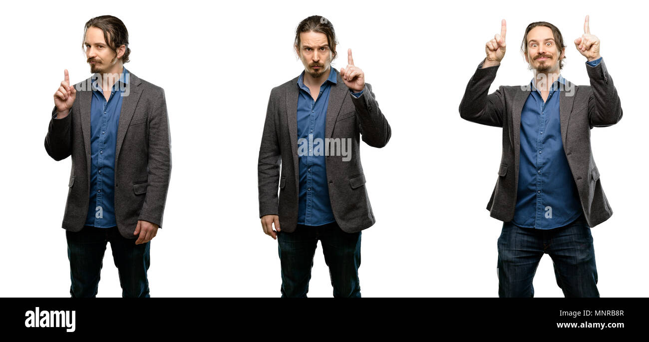 Handsome young man raising his finger, the number one Stock Photo - Alamy