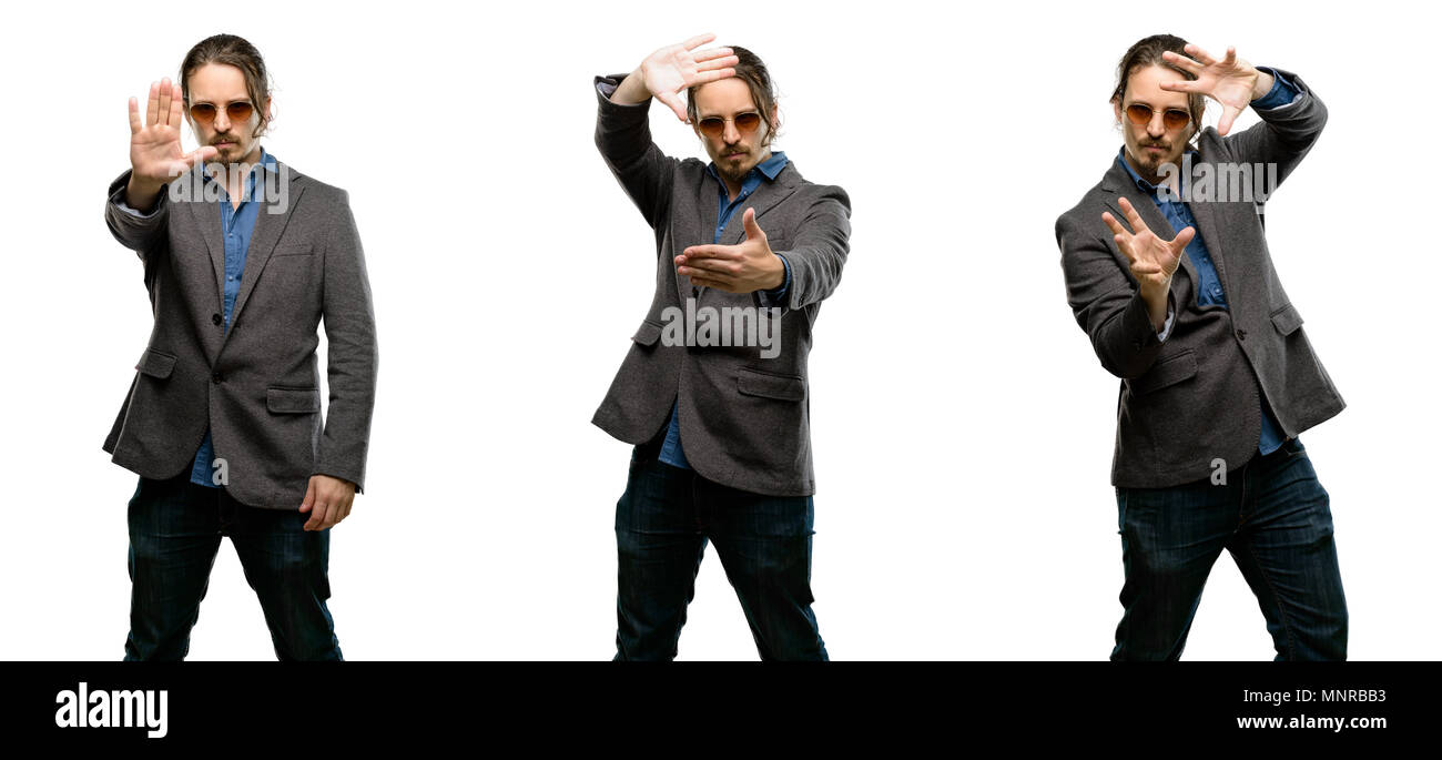 Handsome young man annoyed with bad attitude making stop sign with hand ...