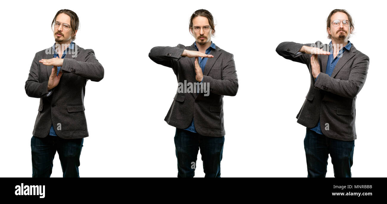 Handsome young man serious making a time out gesture with hands Stock ...
