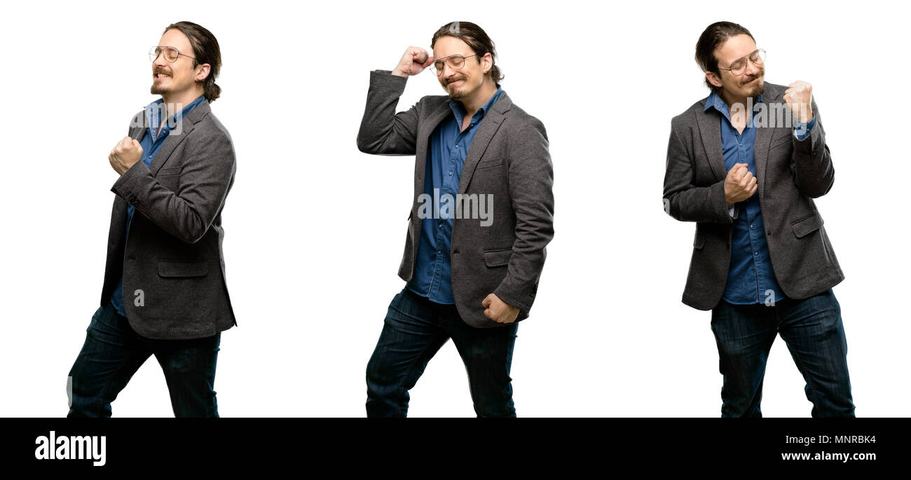 Handsome young man happy and excited celebrating victory expressing big ...