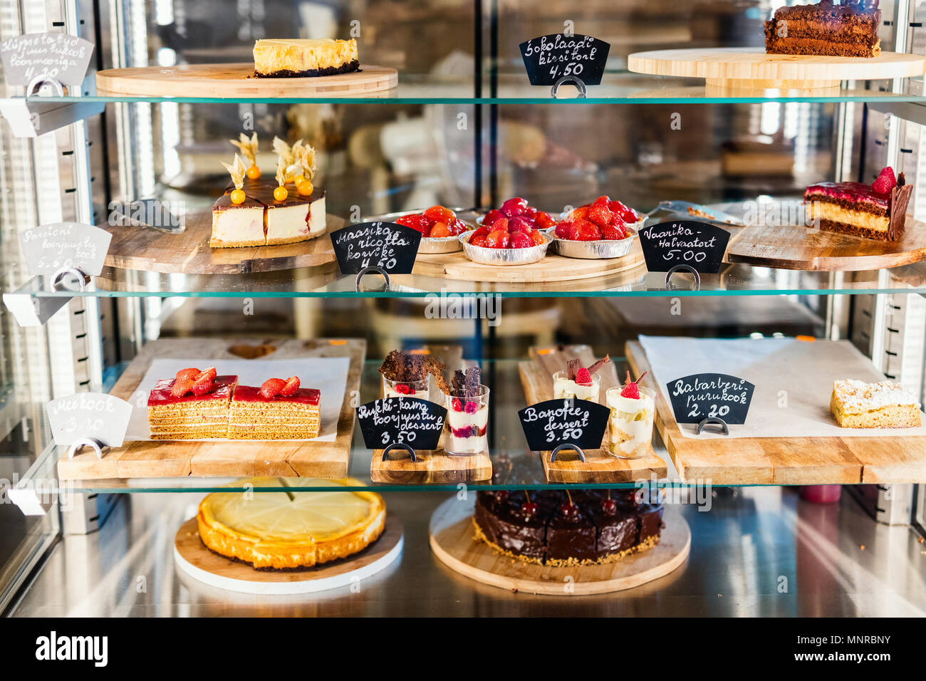 Pastry shop glass display with selection of sweets and cakes Stock ...