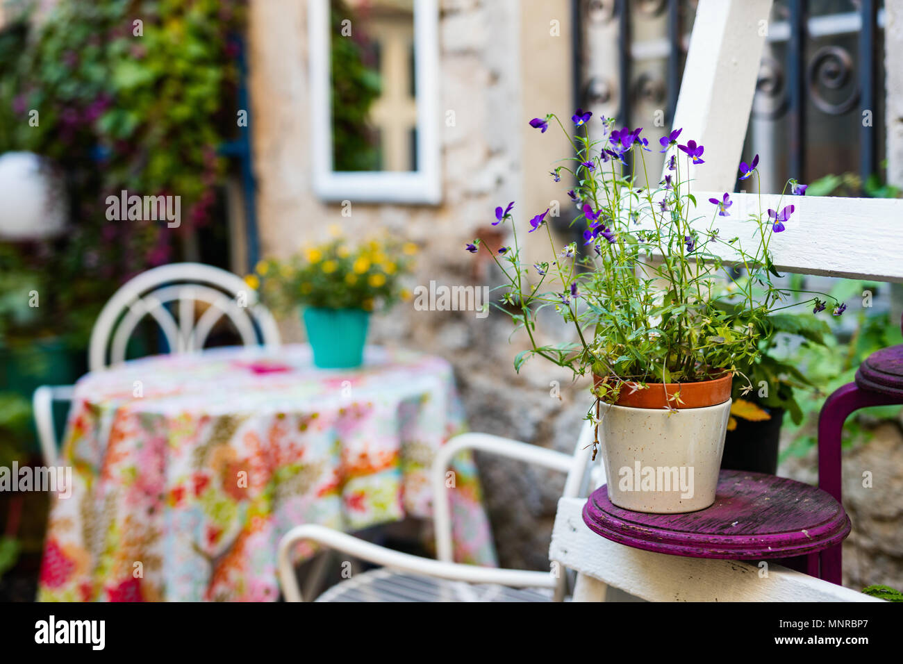 Street with outdoor restaurant tables in Tallinn old town, Estonia ...