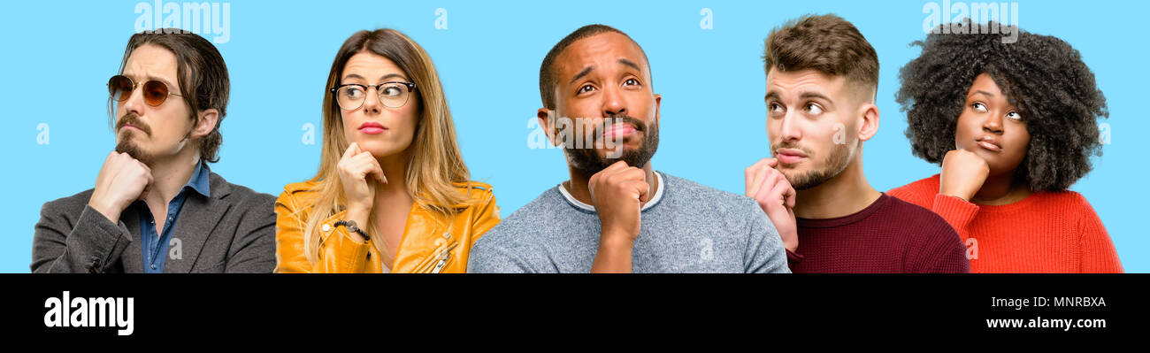 Group of mixed people, women and men thinking and looking up expressing ...