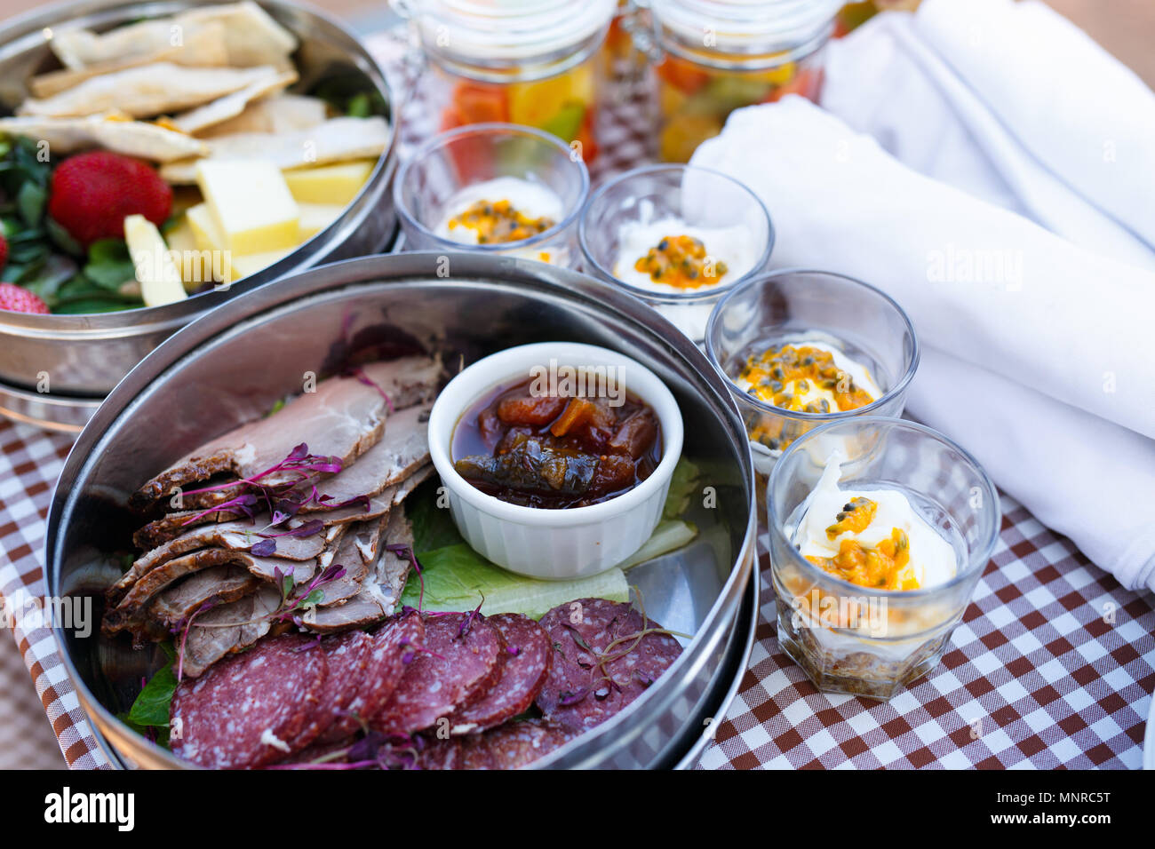 Luxury safari picnic bush breakfast with cheese and cold meat served ...