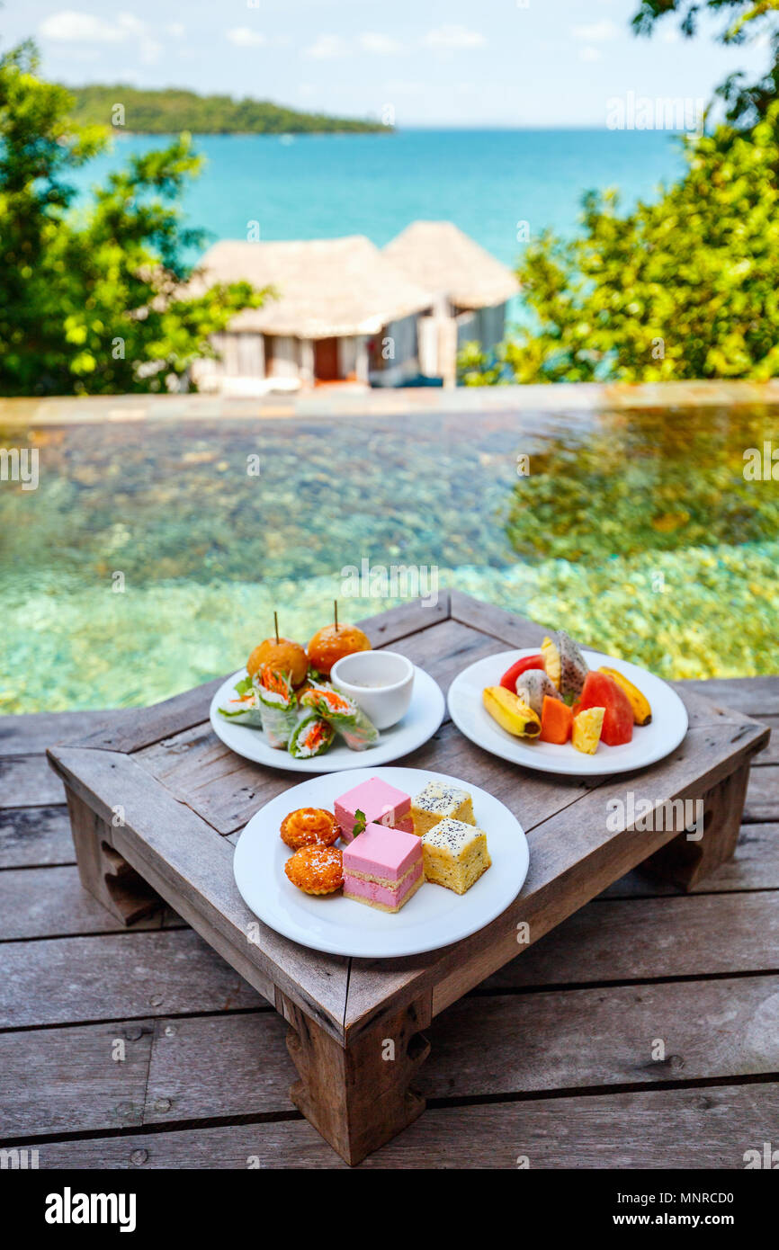 Room service delicious lunch burgers, fruits and sweets served on a ...