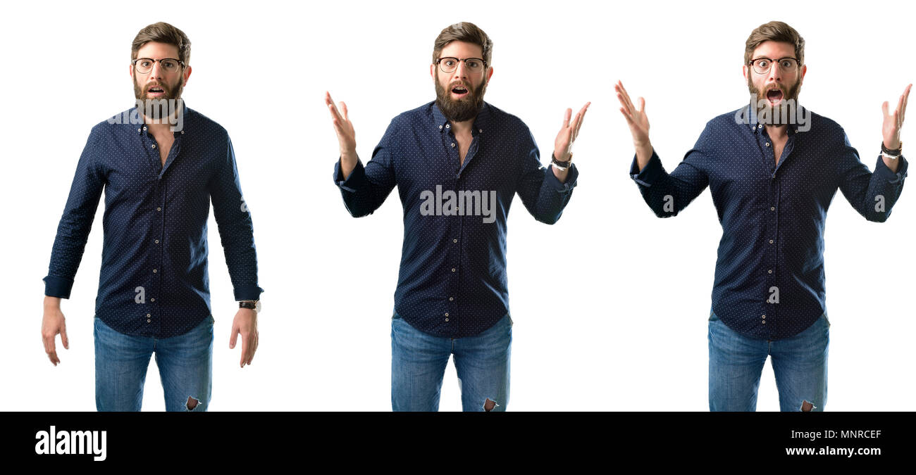 Young man with beard scared in shock, expressing panic and fear ...