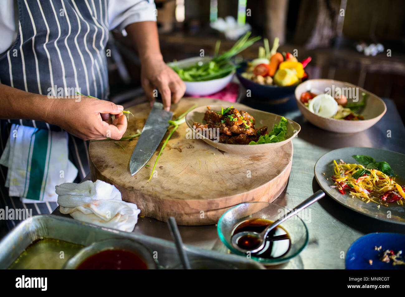 Chef making traditional cambodian meat dish at cooking class Stock ...