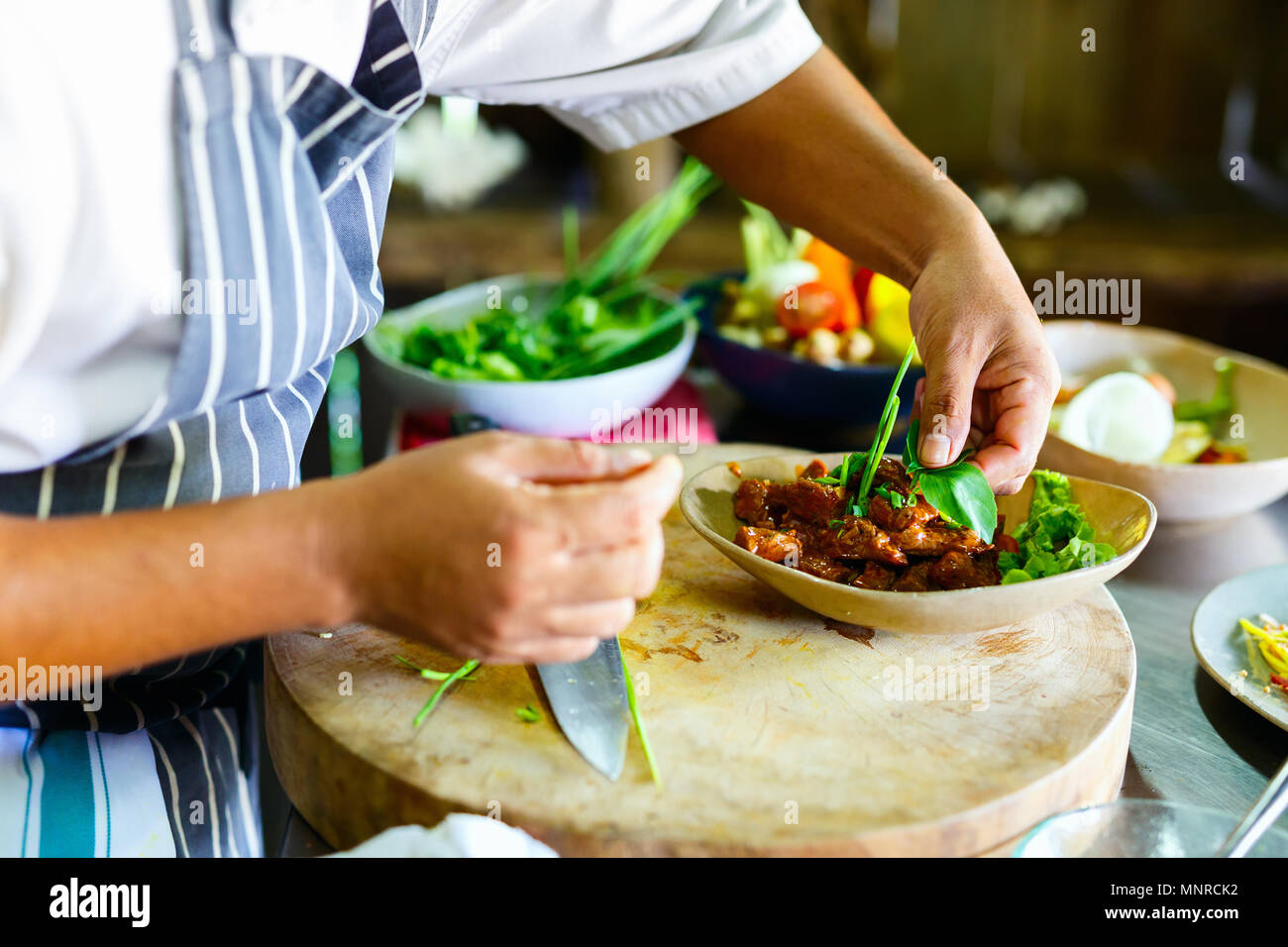 Chef making traditional cambodian meat dish at cooking class Stock ...