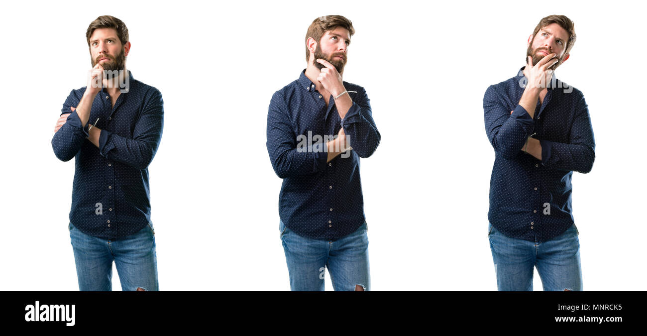 Young man with beard thinking and looking up expressing doubt and ...