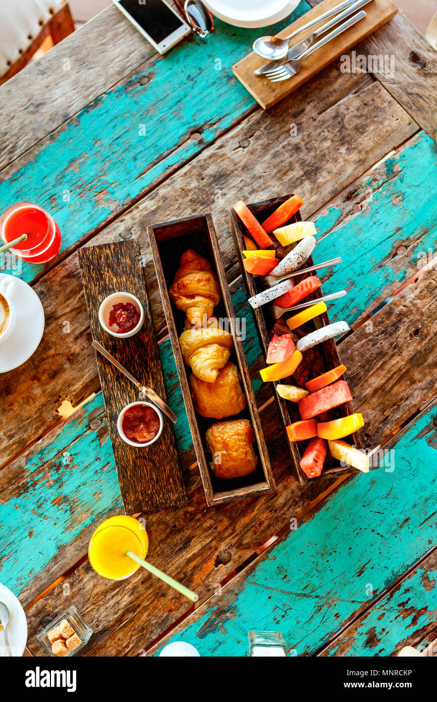 Top view of delicious organic food served for breakfast on rustic ...