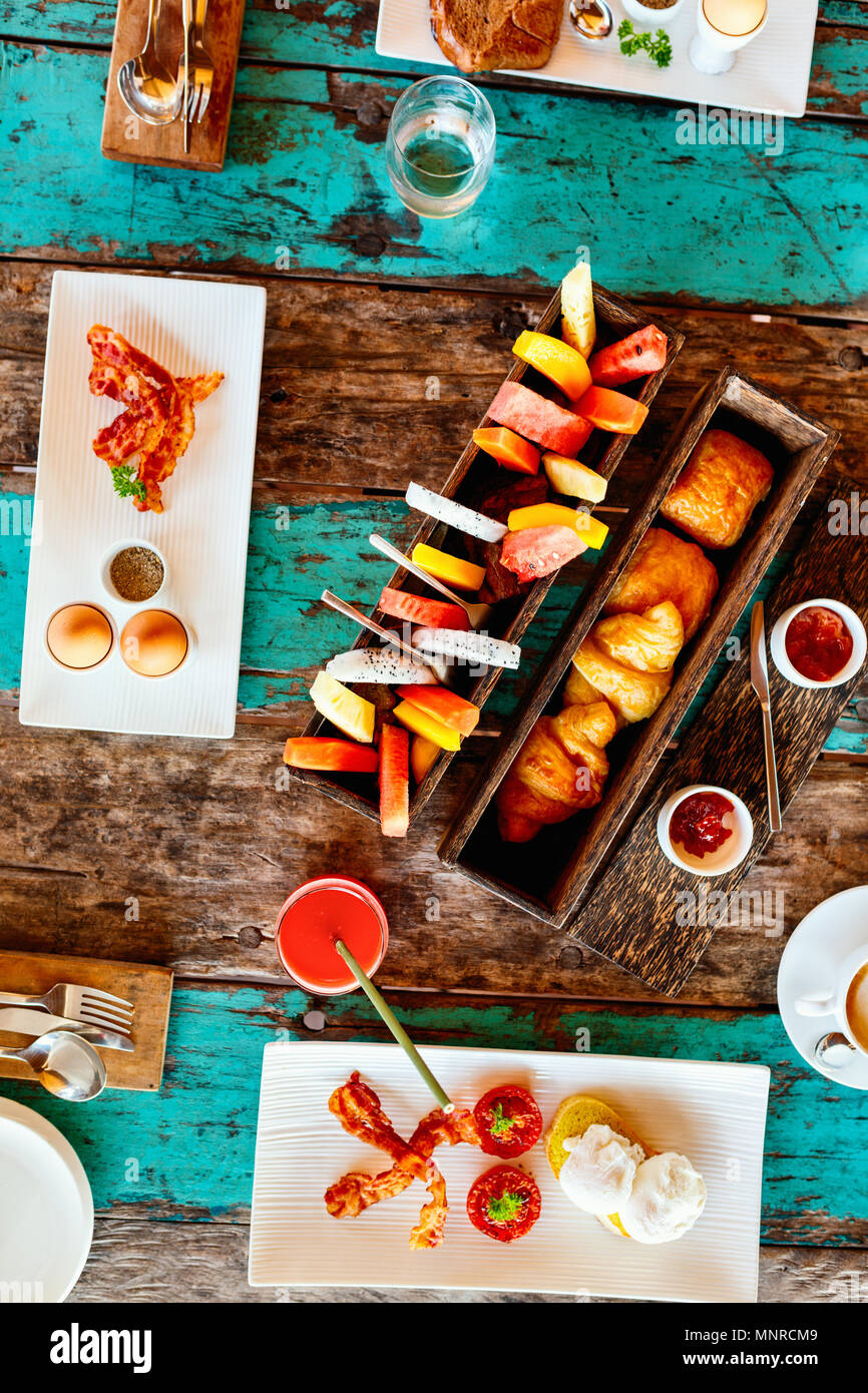 Top view of delicious organic food served for breakfast on rustic ...