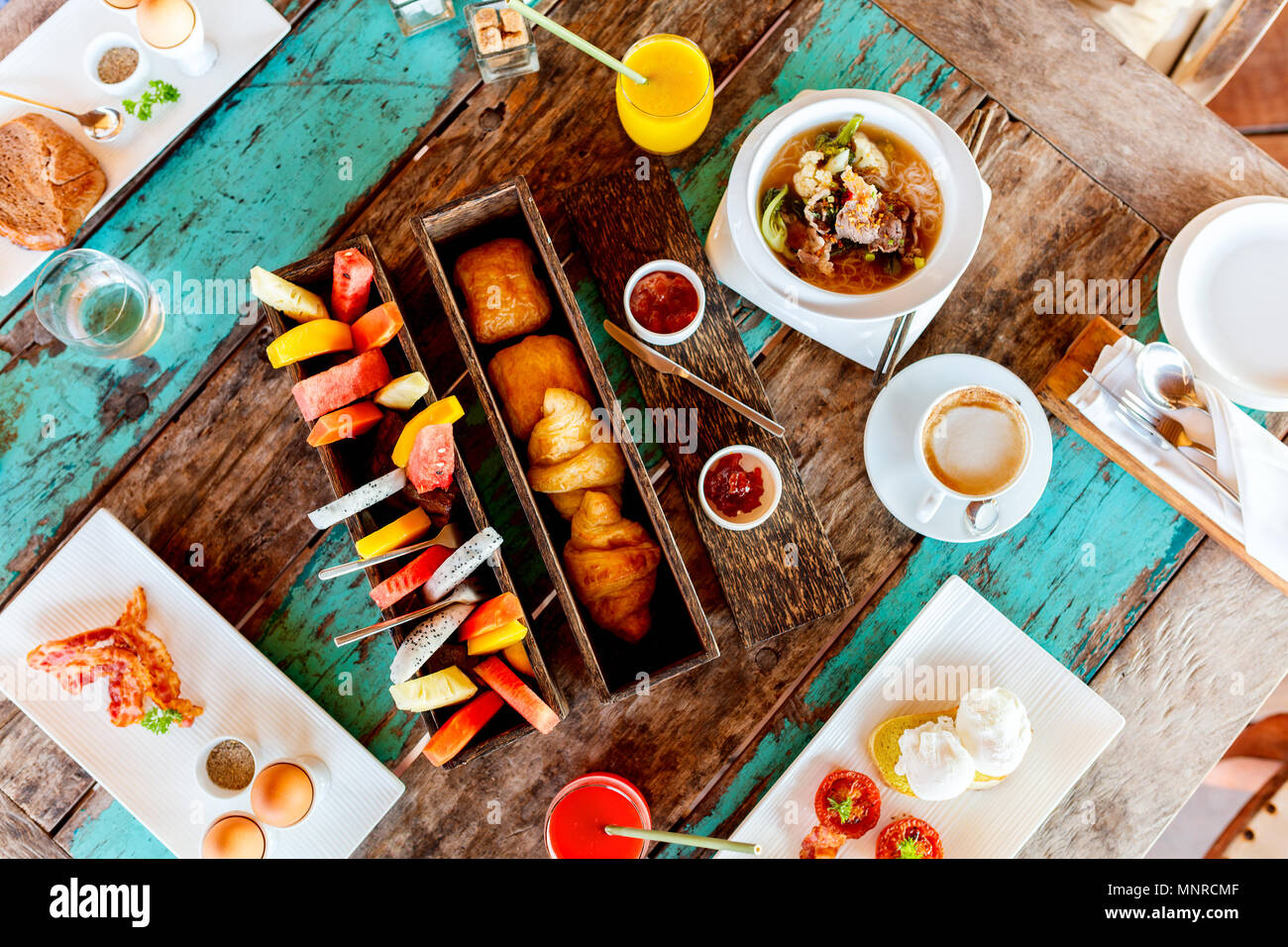 Top view of delicious organic food served for breakfast on rustic ...