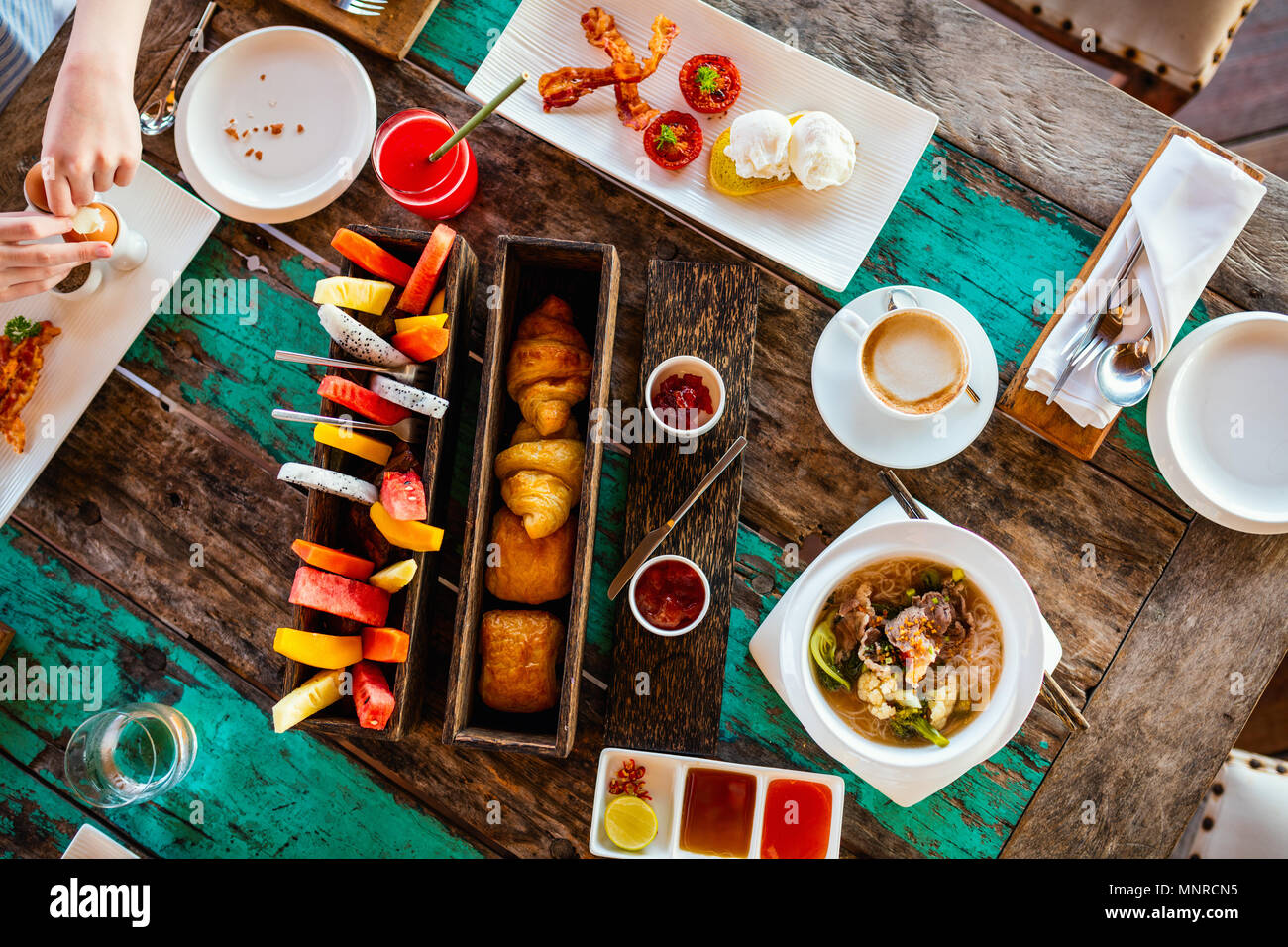 Top view of delicious organic food served for breakfast on rustic ...