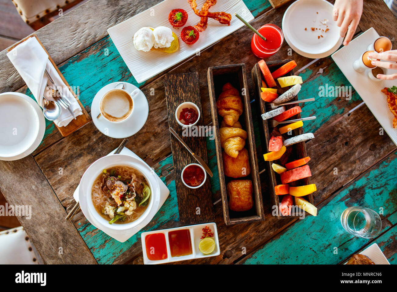 Top view of delicious organic food served for breakfast on rustic ...