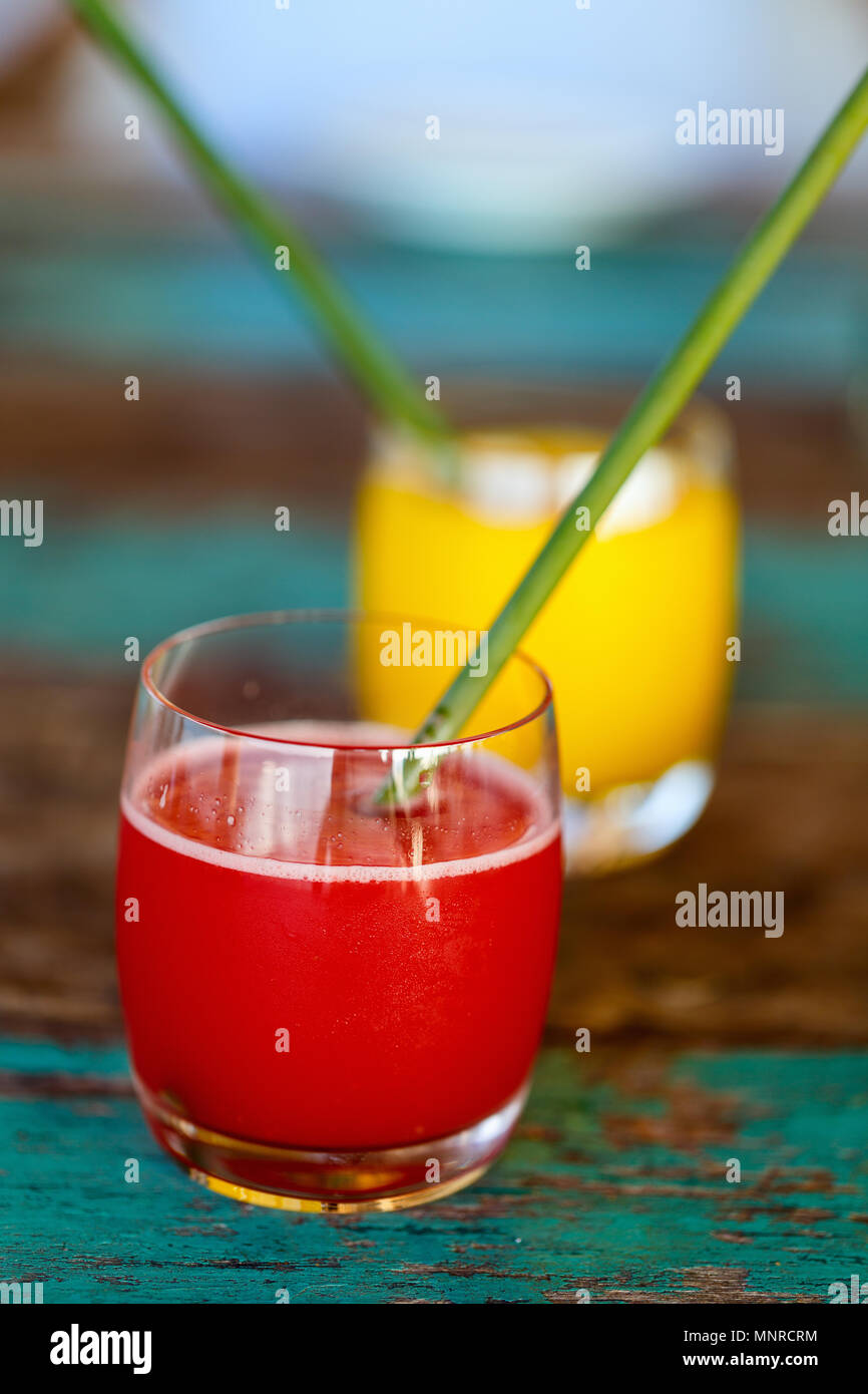 Tropical watermelon and mango juices on a table Stock Photo - Alamy