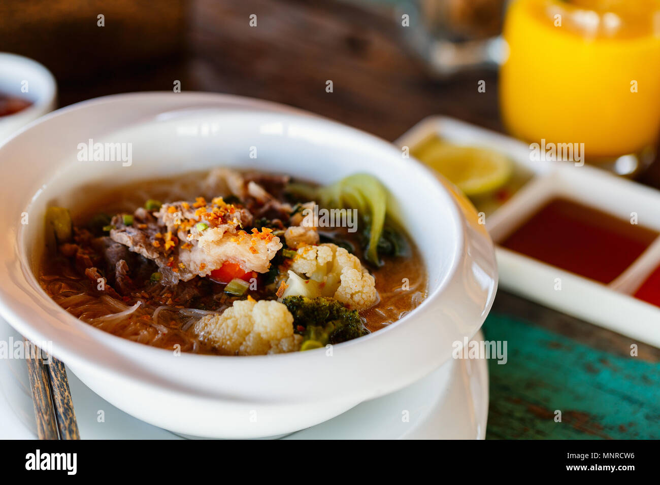 Delicious Asian noodle and meat dish served for breakfast or lunch ...