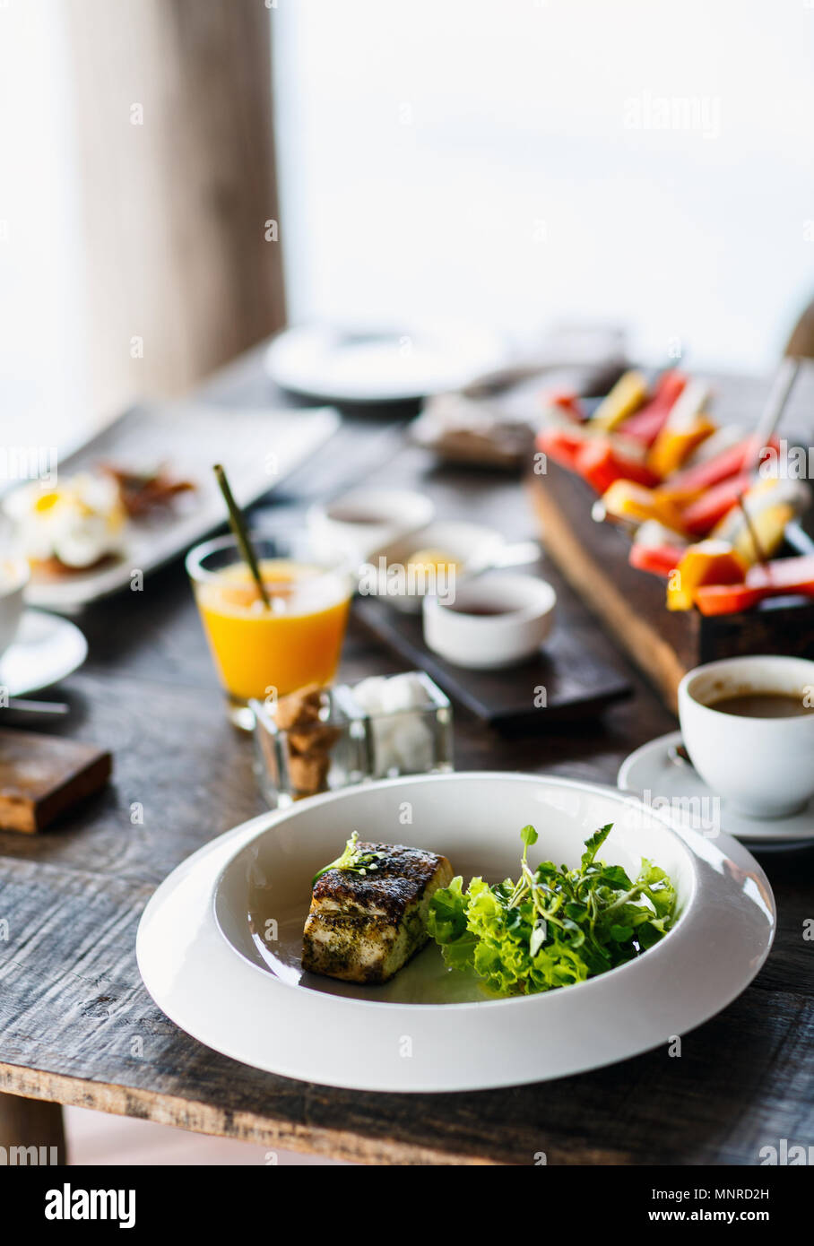 Delicious lunch of fish and green vegetables Stock Photo - Alamy