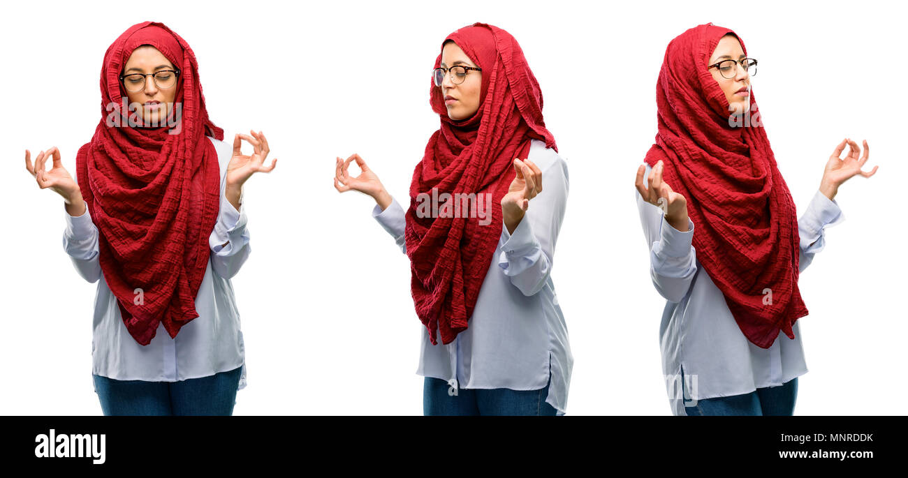 Arab woman wearing hijab doing ok sign gesture with both hands ...