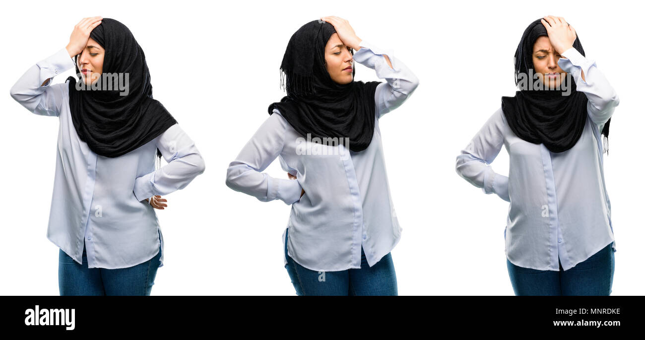 Arab woman wearing hijab stressful keeping hand on head, tired and ...