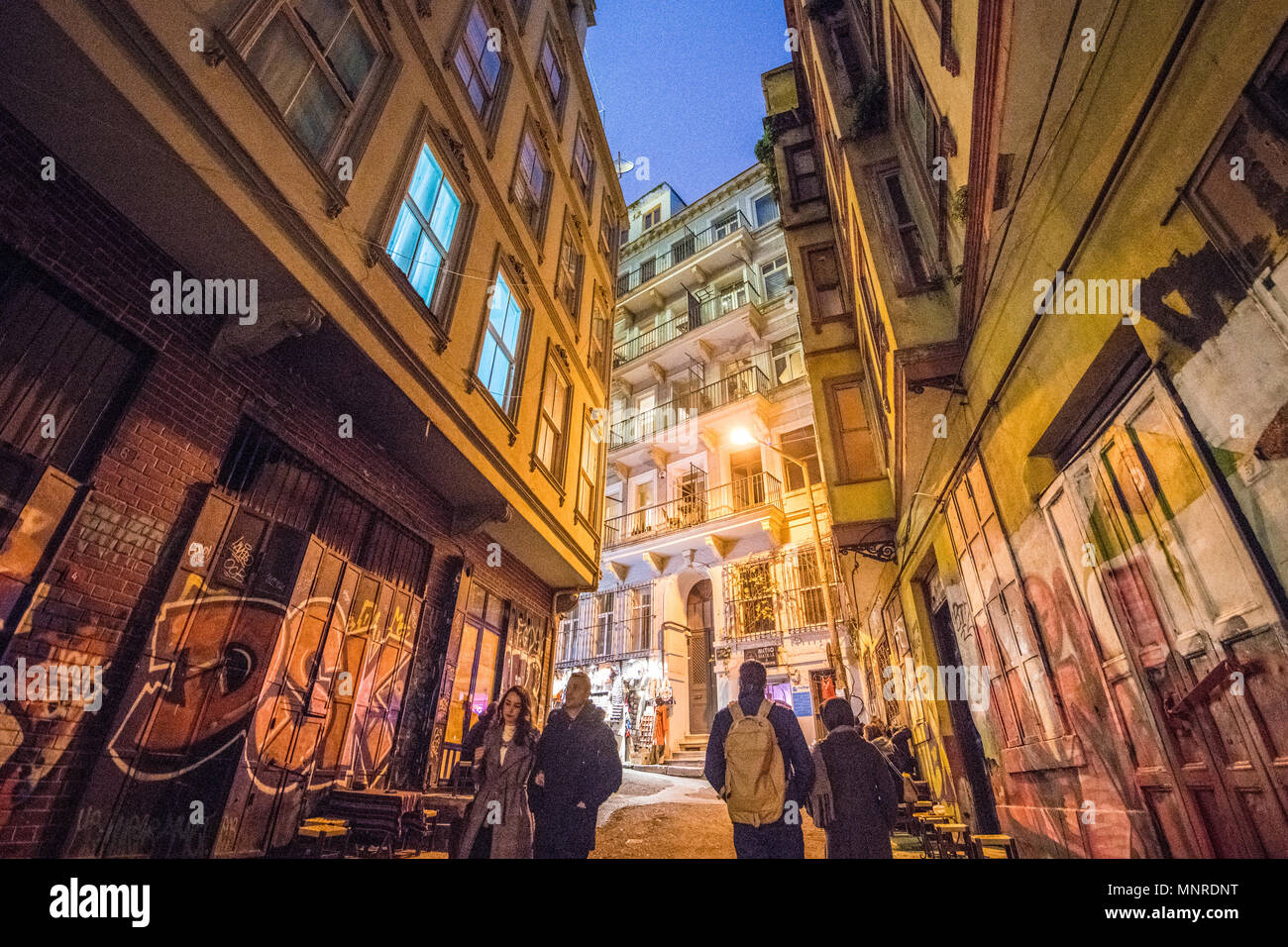Low angle view of a tight alleyway in between buildings in the city of ...