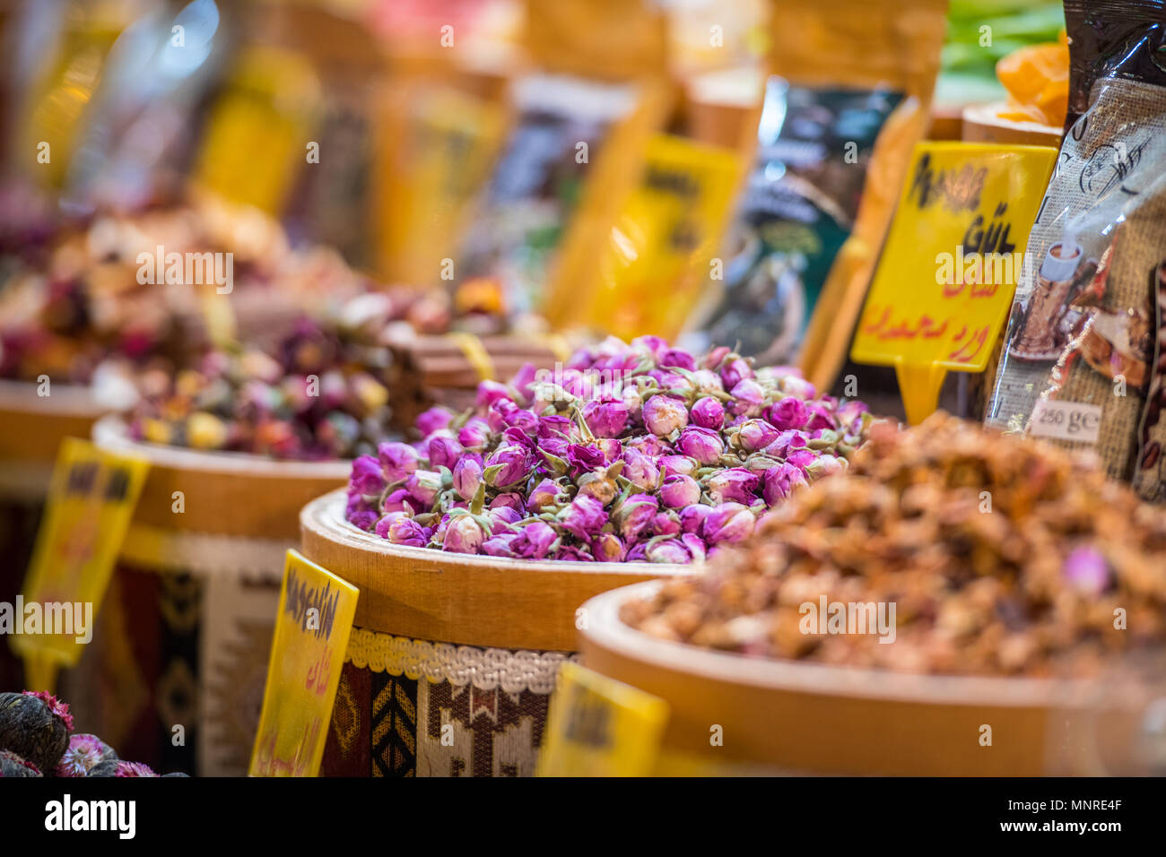 Bright-pink tea flowers fill wooden basket at Istanbul Spice bazaar in ...
