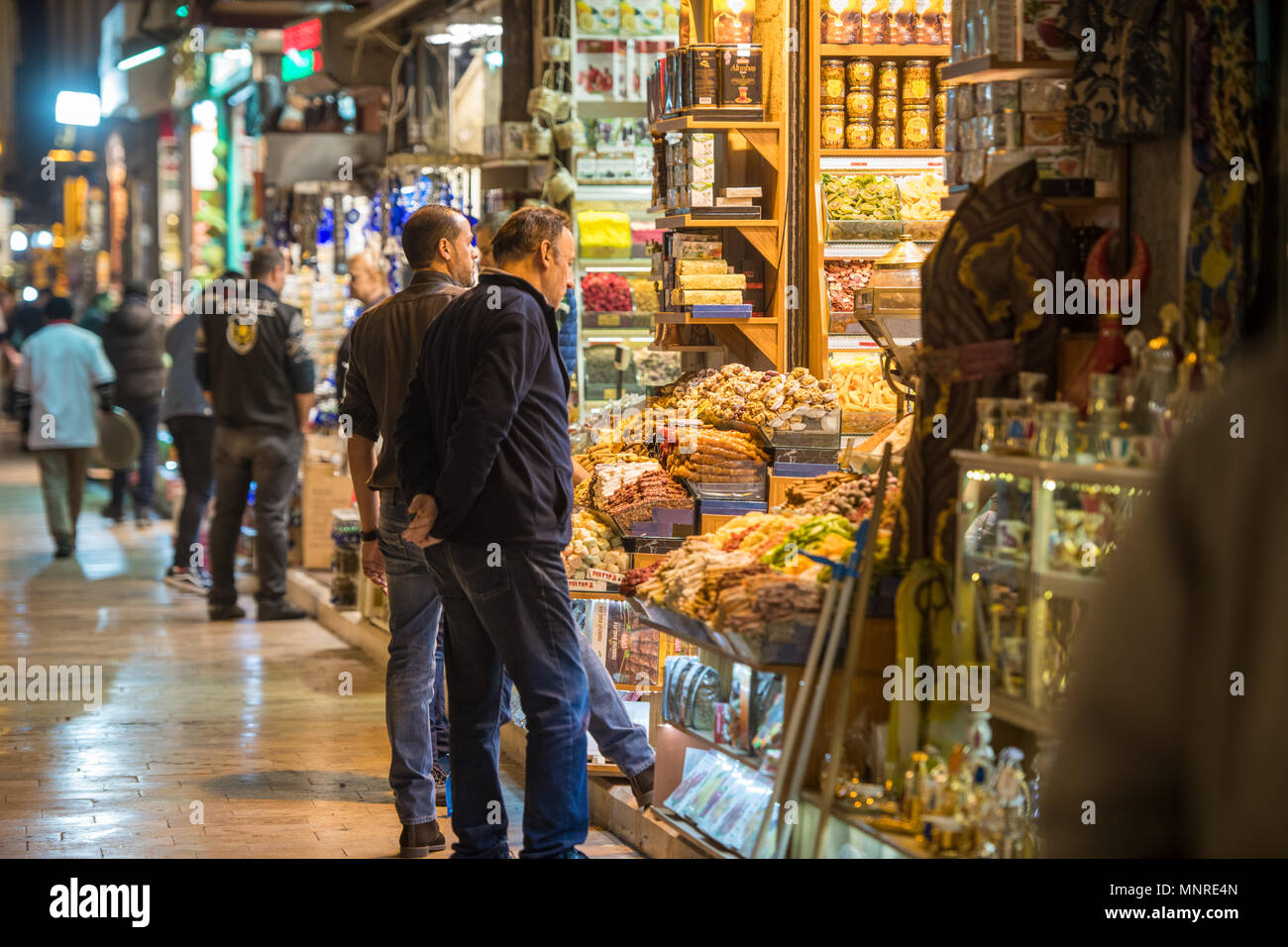 Men stand at front of storefront off of main avenue of Istanbul Spice ...