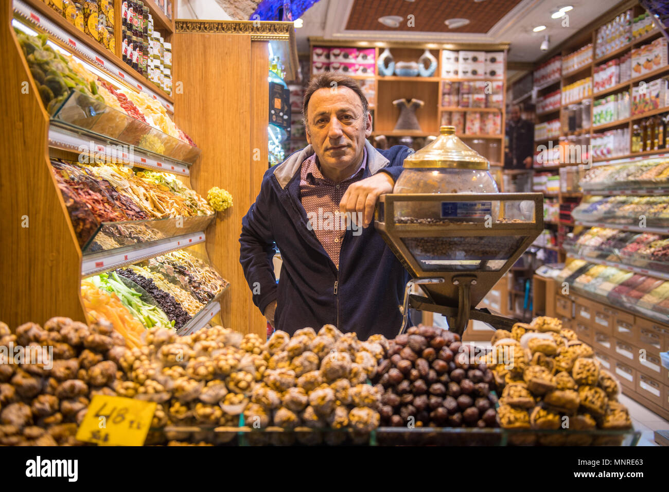 Merchant of spice shop at Istanbul Spice bazaar in Turkey stops to pose ...