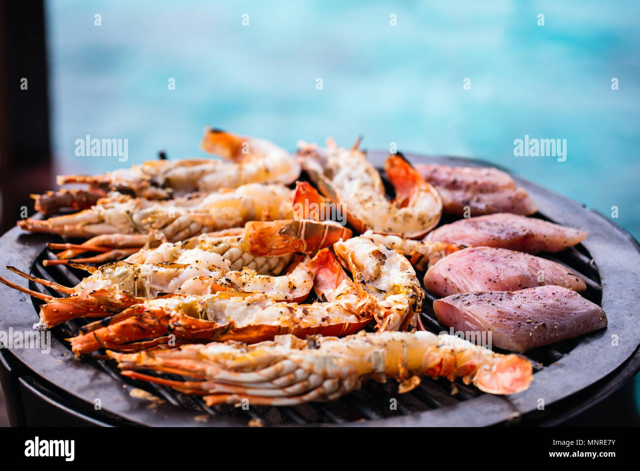 Close up of fresh lobsters and crayfish grilling on open fire Stock ...