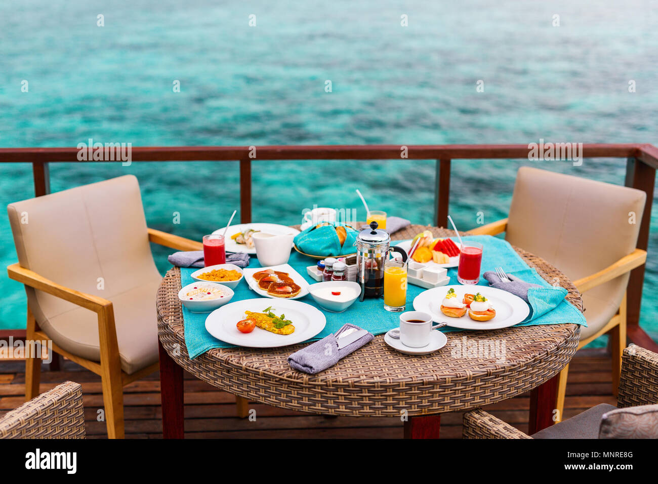 Delicious breakfast at tropical ocean edge in a luxury resort Stock ...