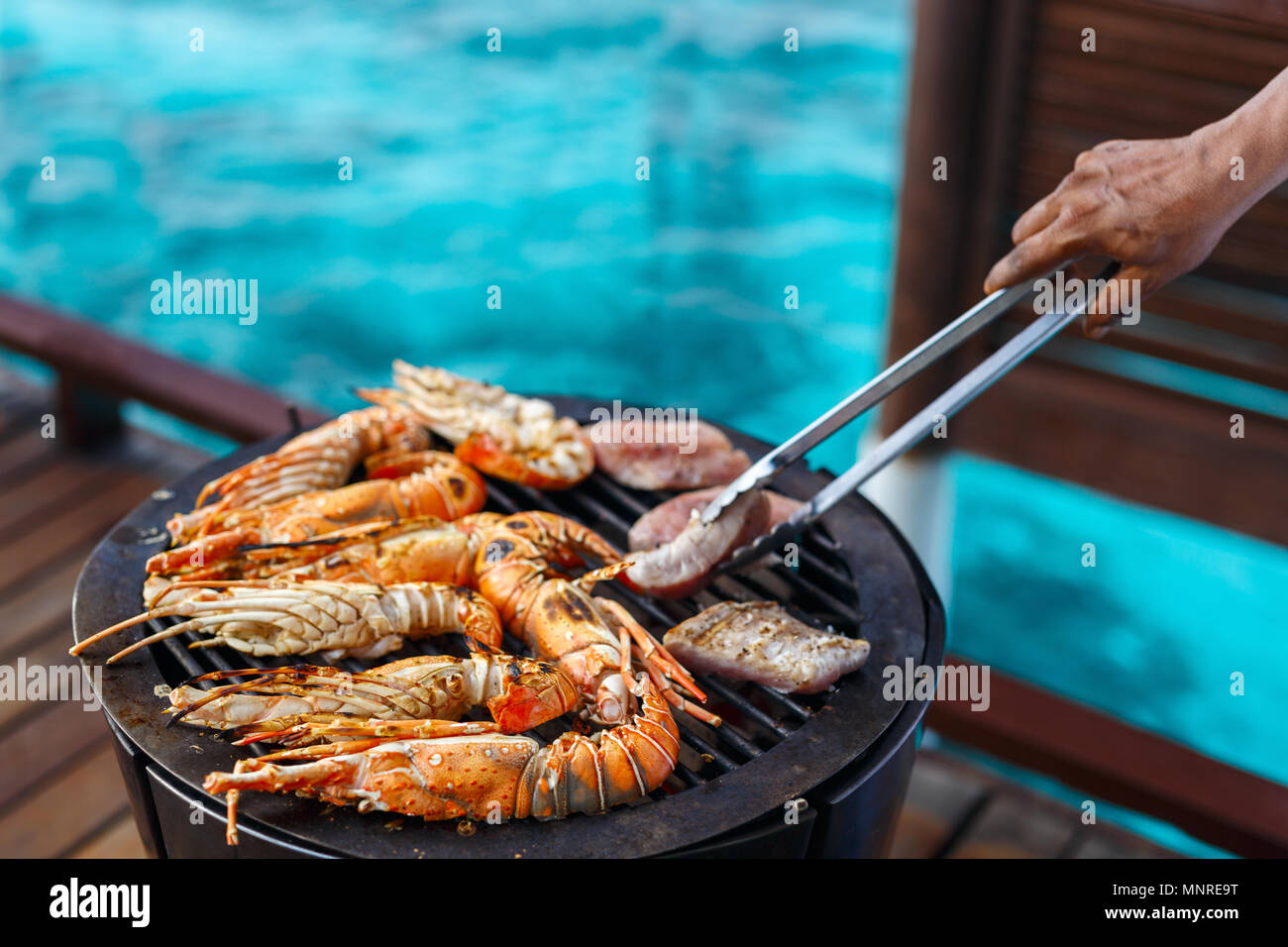 Close up of fresh lobsters and crayfish grilling on open fire Stock ...