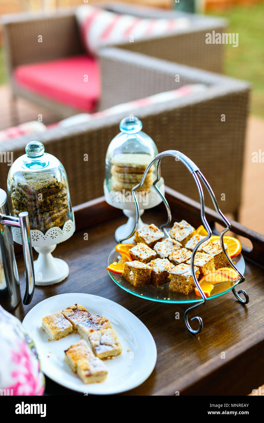 Variety of sweets served on a buffet table Stock Photo - Alamy