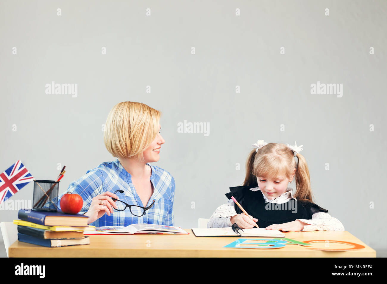 English language studying process, intelligent blond teacher work with ...