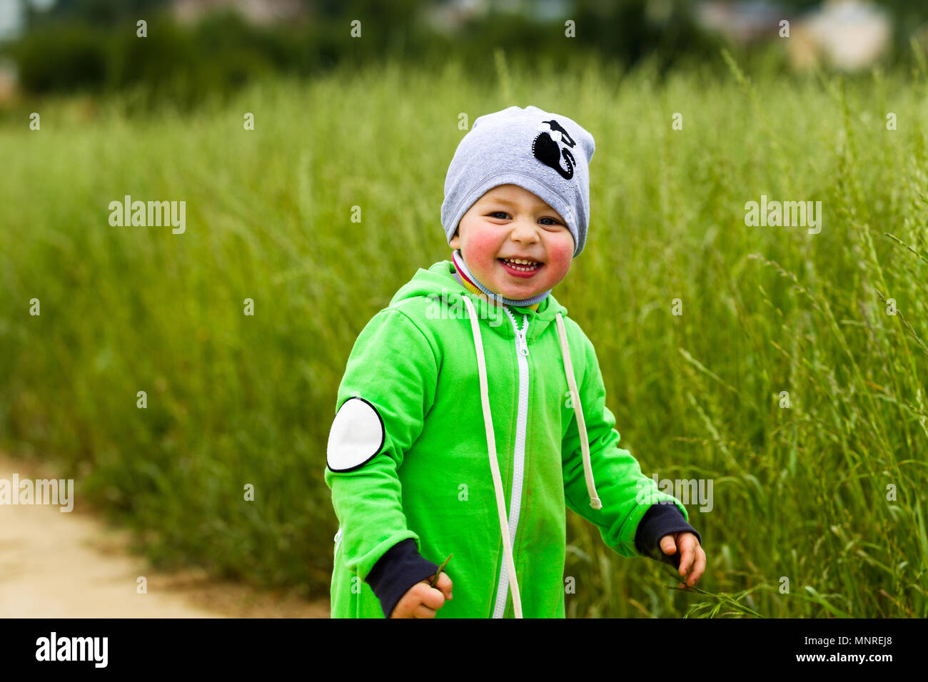 Emotional child on a walk outside the city Stock Photo - Alamy