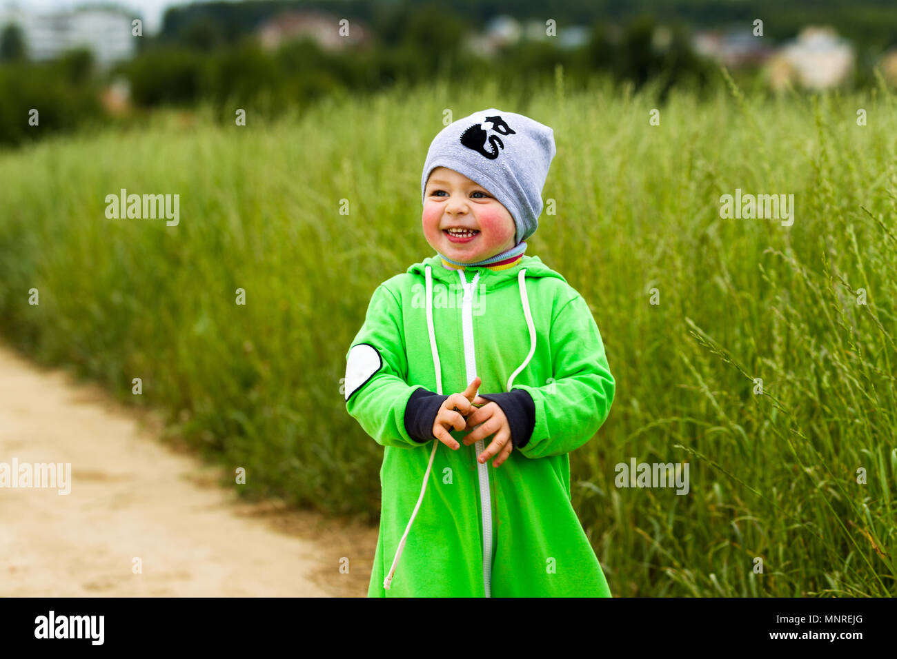 Emotional child on a walk outside the city Stock Photo - Alamy