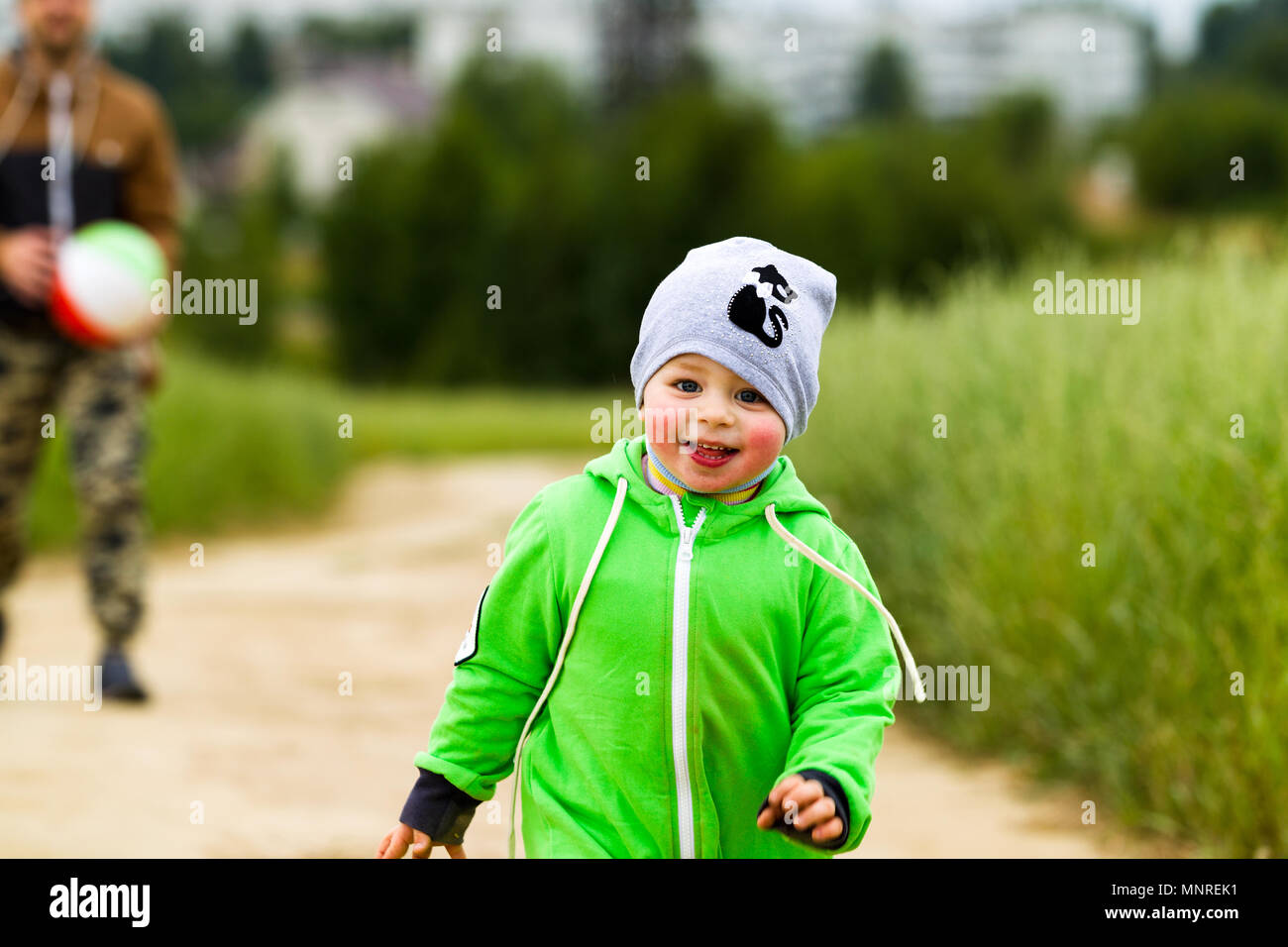 Emotional child on a walk outside the city Stock Photo - Alamy
