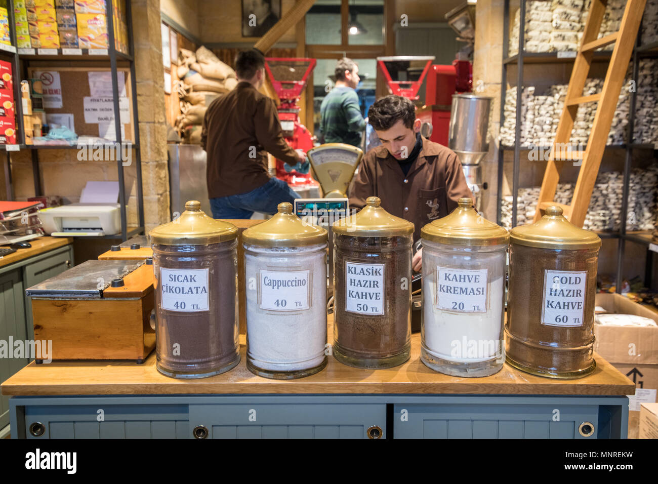 Glass containers full of different blend of coffee sit on display in ...