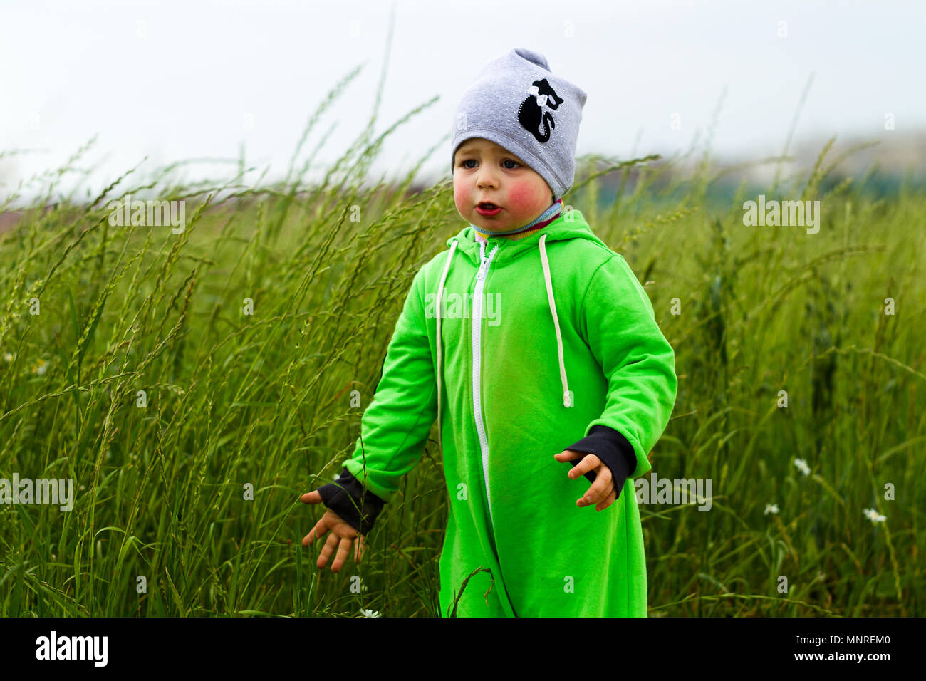 Emotional child on a walk outside the city Stock Photo - Alamy