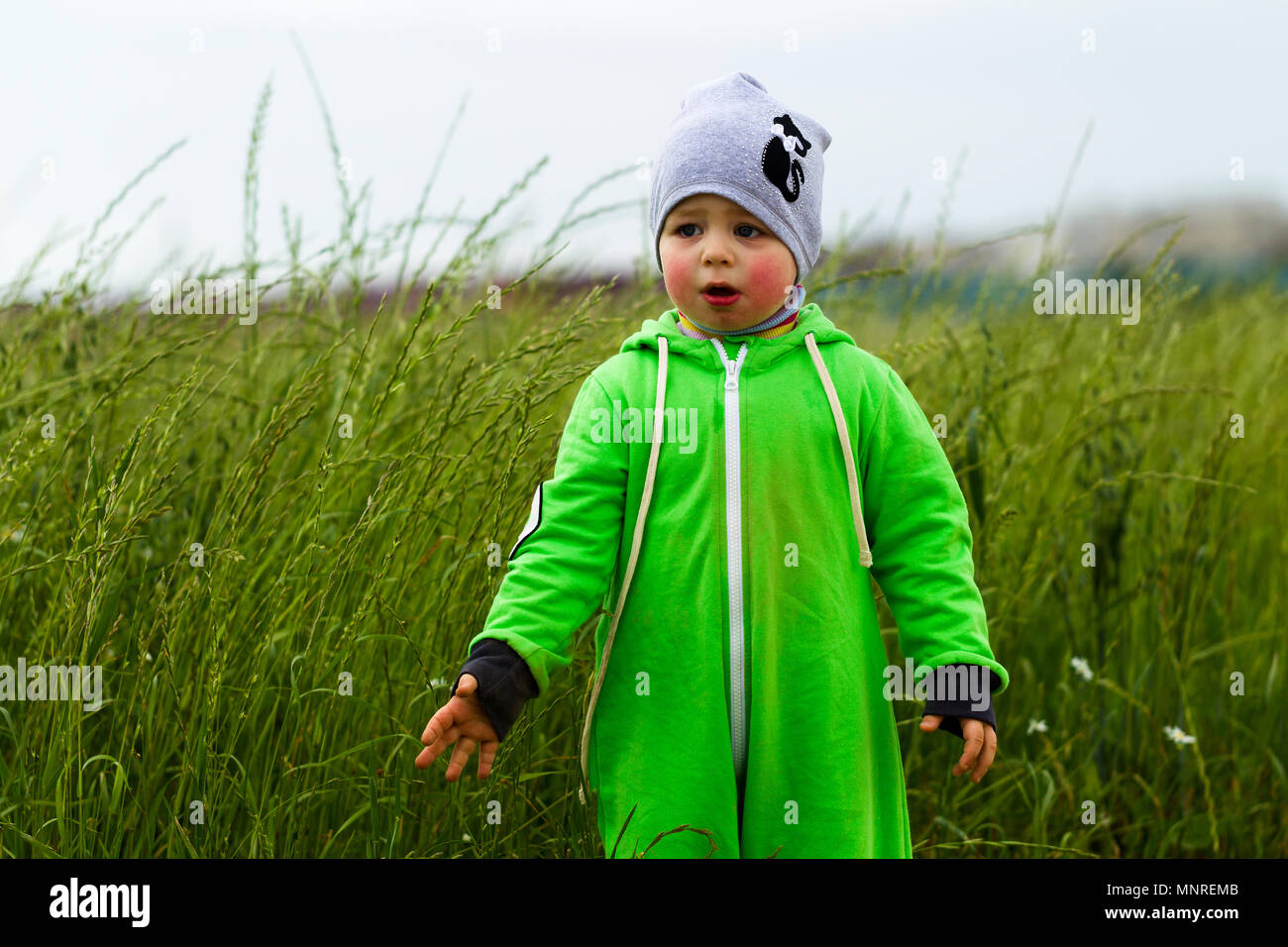 Emotional child on a walk outside the city Stock Photo - Alamy