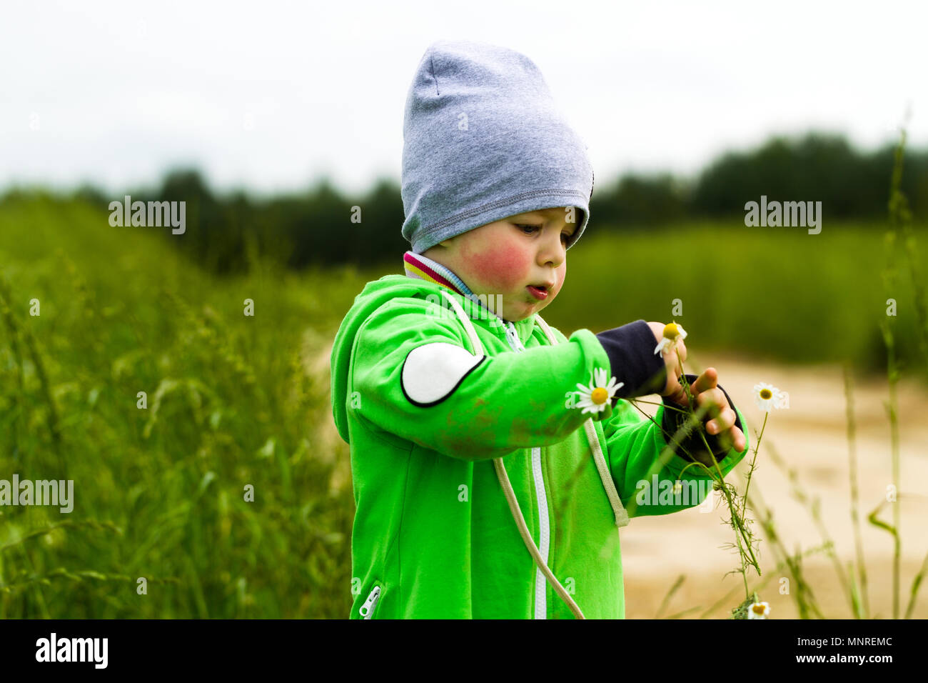 Emotional child on a walk outside the city Stock Photo - Alamy