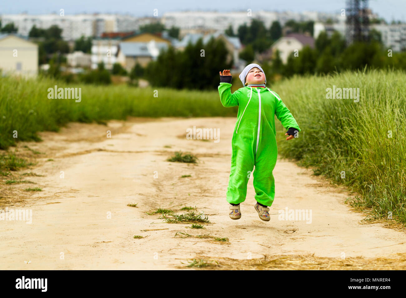 Emotional child on a walk outside the city Stock Photo - Alamy