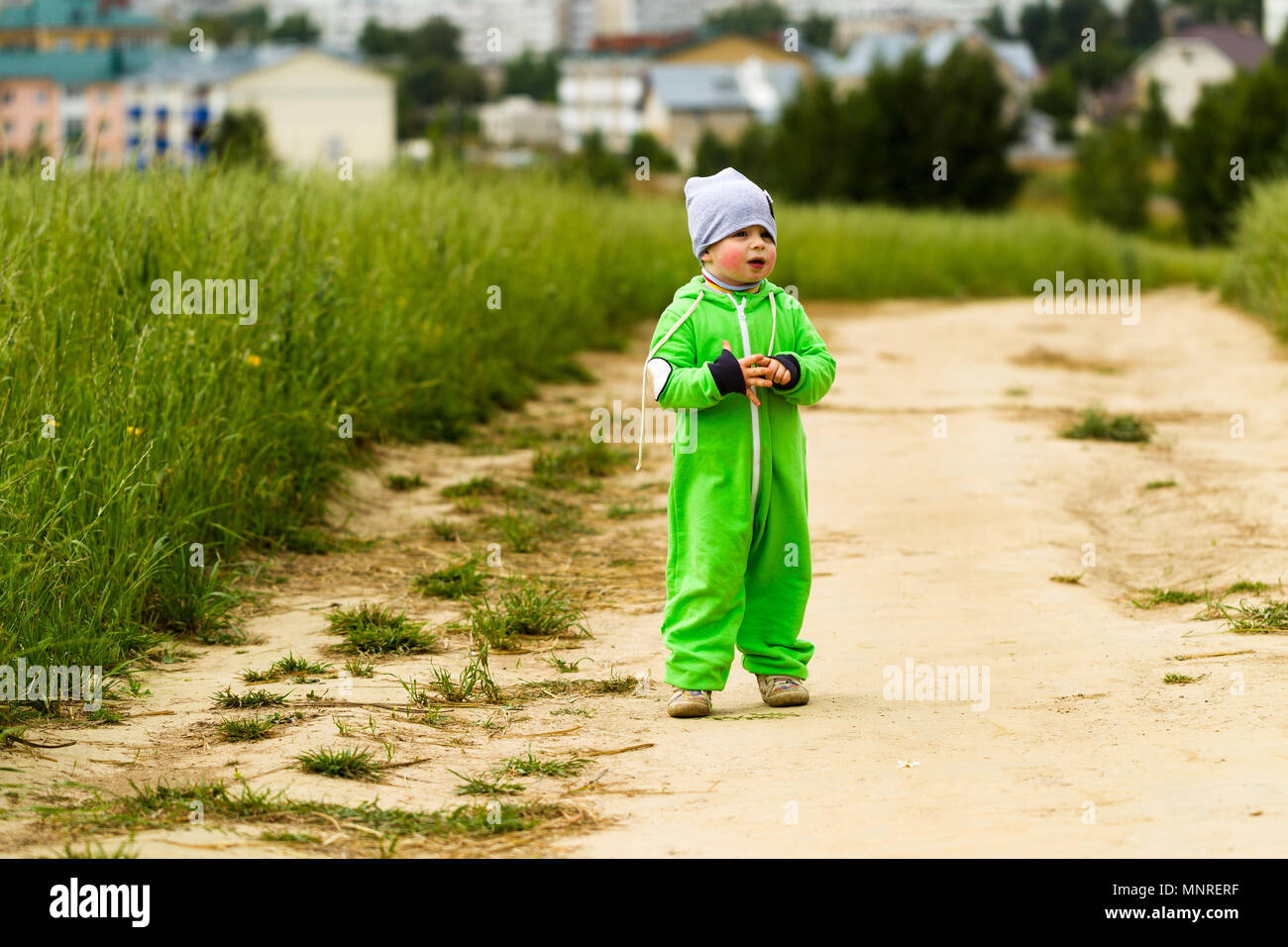 Emotional child on a walk outside the city Stock Photo - Alamy