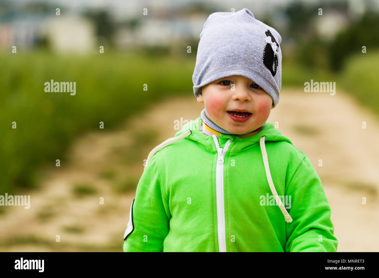 Emotional child on a walk outside the city Stock Photo - Alamy