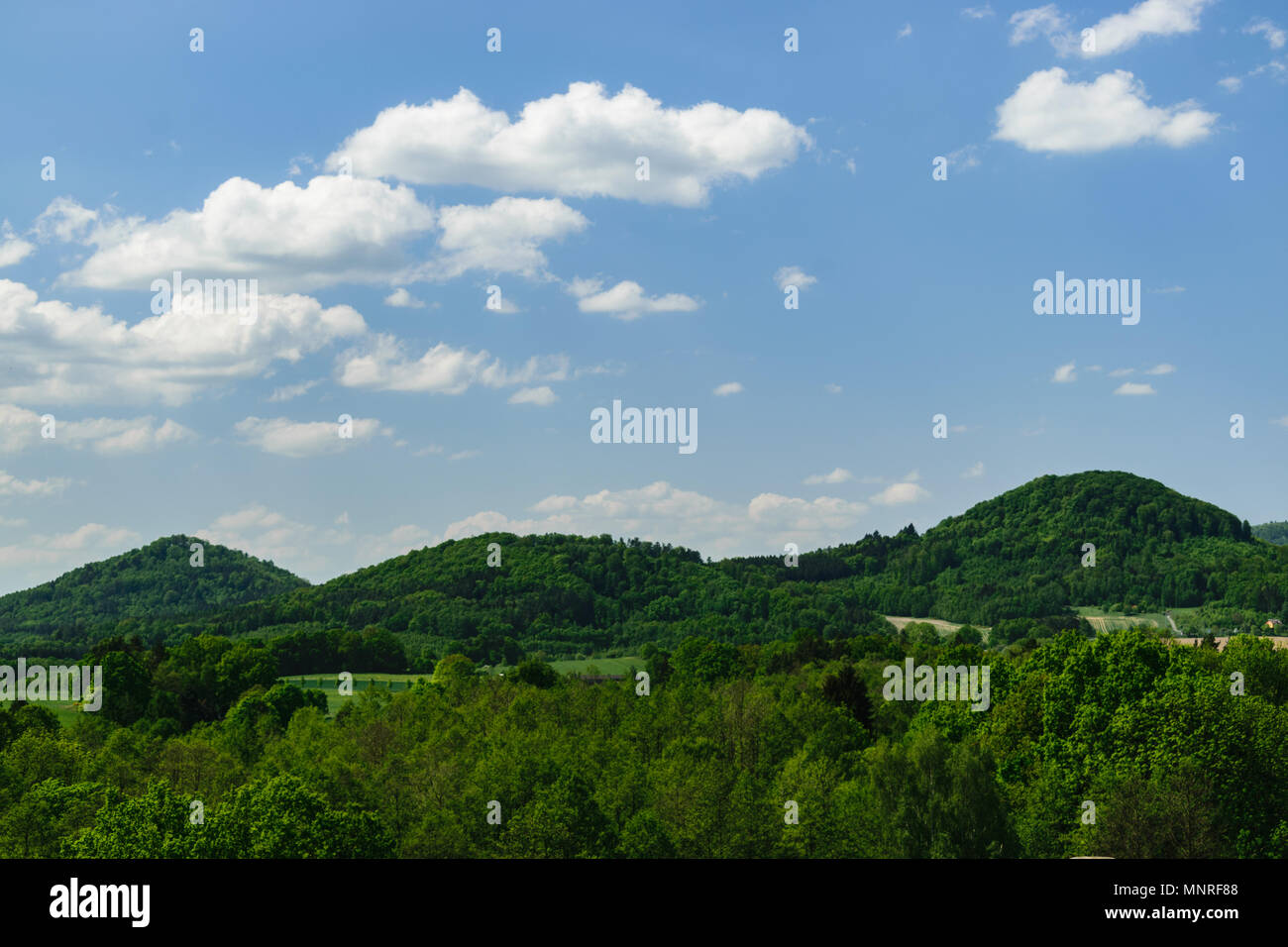 Three Hills in the Distance Stock Photo - Alamy