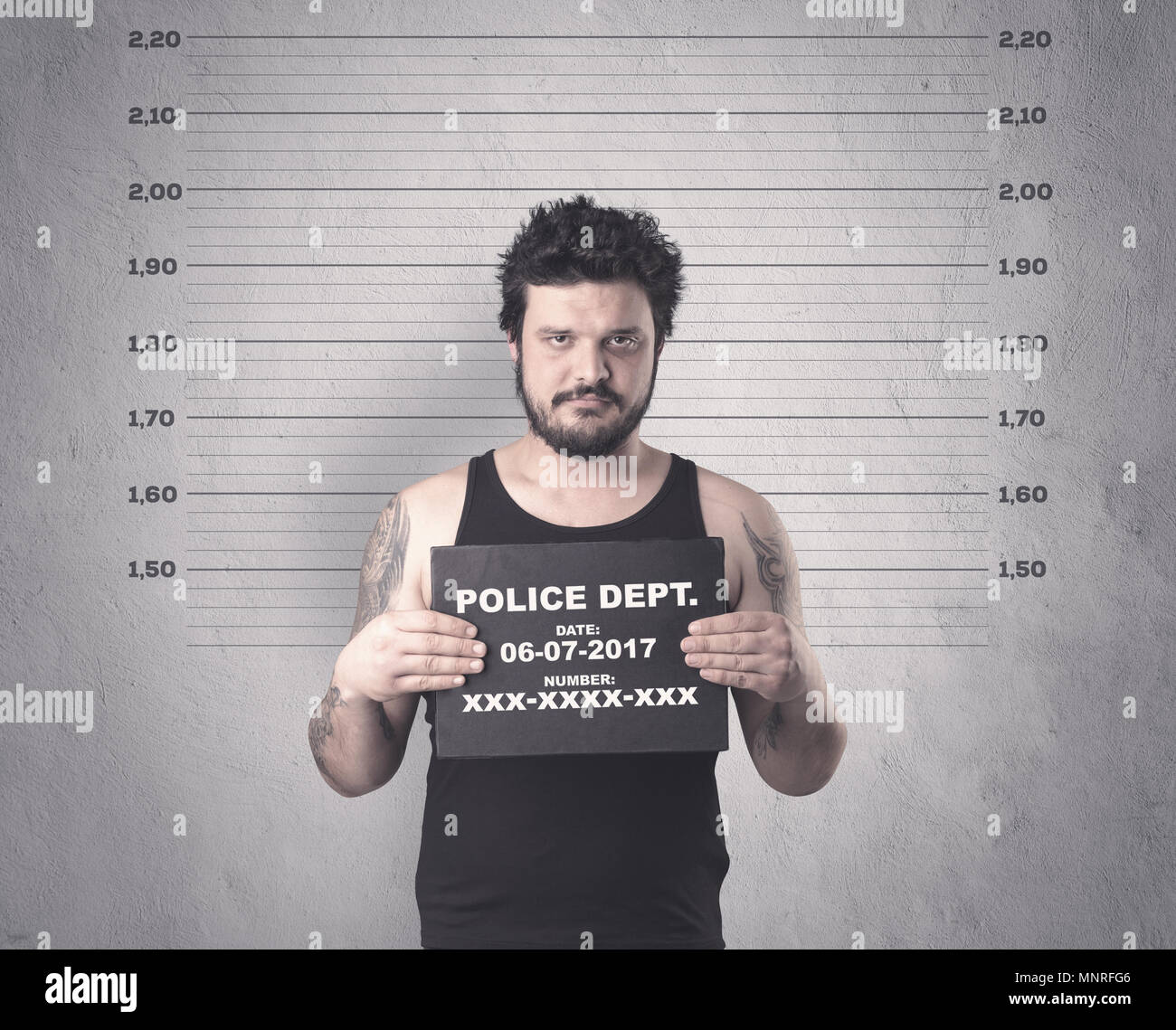 Caught gangster in jail with table on his hand Stock Photo - Alamy