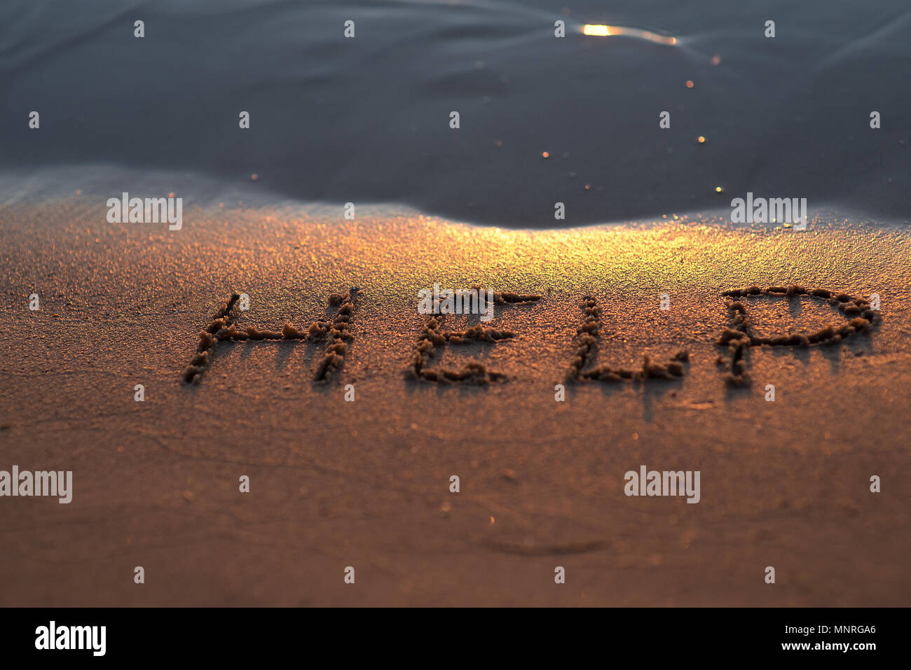 Sos written in the sand hi-res stock photography and images - Alamy