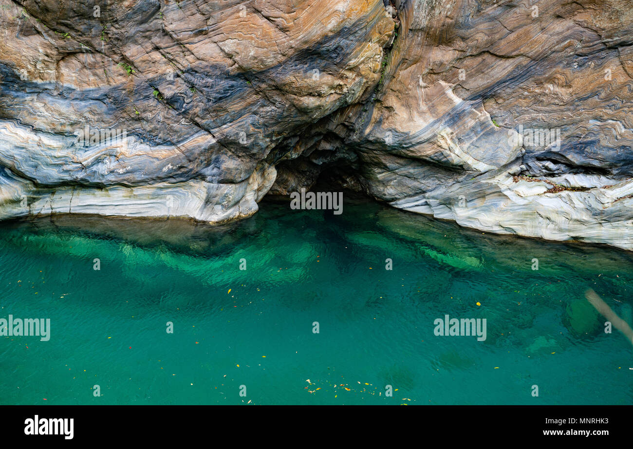 Marble cliff and colorful clear blue water in taroko gorge national ...