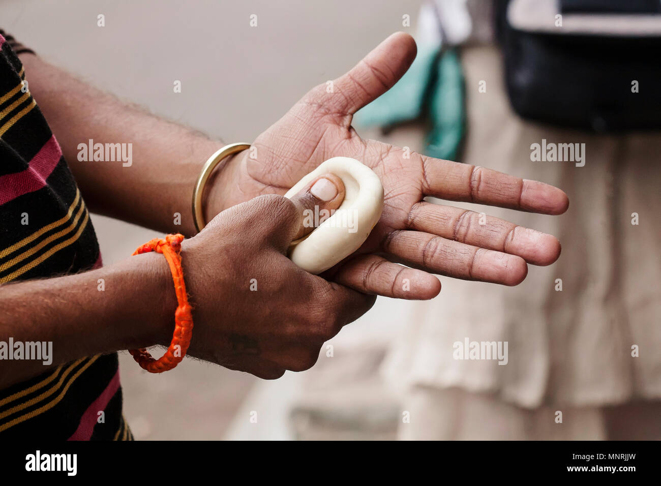 Indian male hands preparing Katchuri - traditional Indian fried food ...