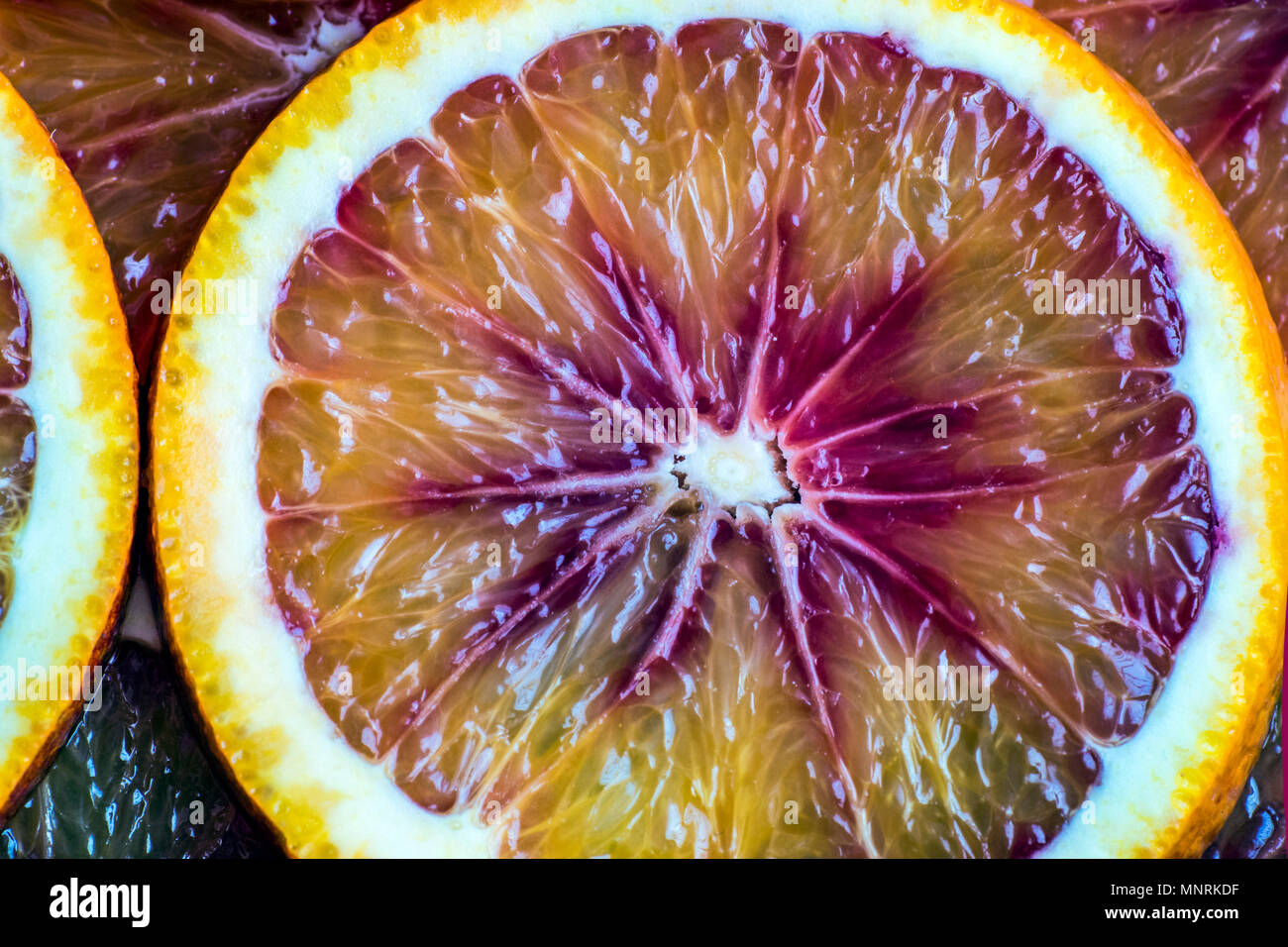 round slices of red orange, background and texture Stock Photo - Alamy